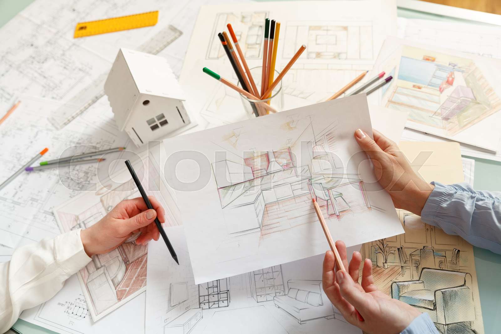 Discussion of interior hand drawings | Stock image | Colourbox