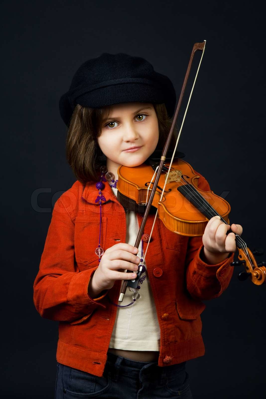 Girl practicing the violin | Stock image | Colourbox