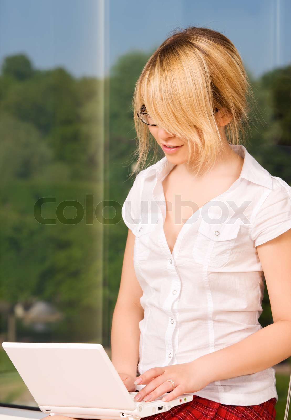 picture of office girl with laptop computer | Stock image | Colourbox