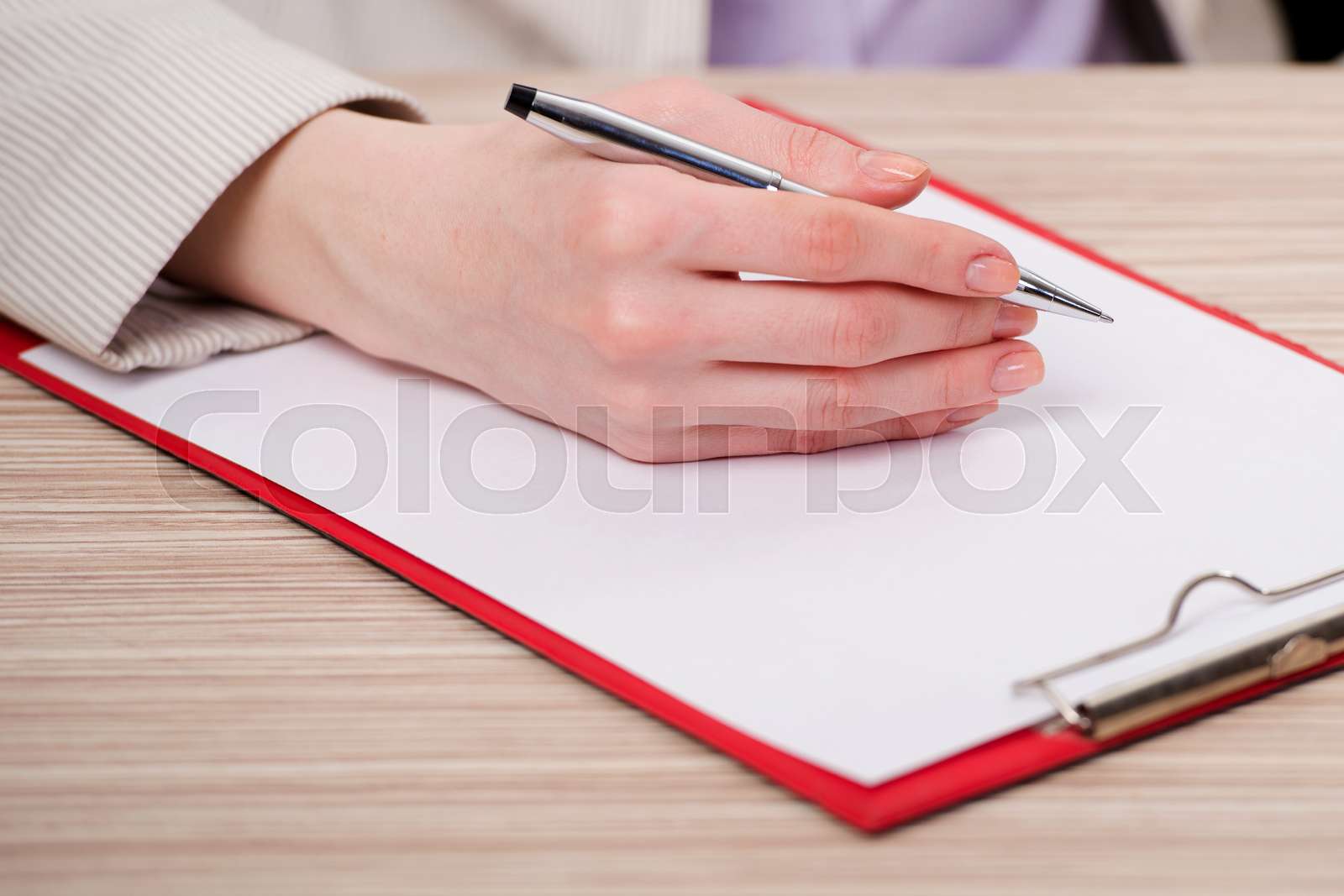Hands taking notes in the pad | Stock image | Colourbox