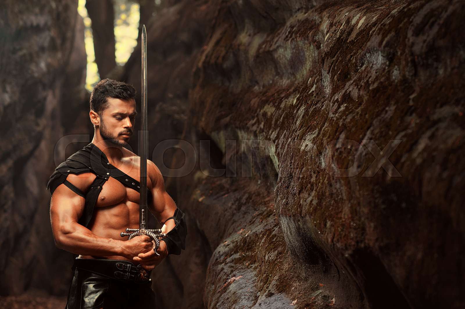 Manly warrior at the mountains | Stock image | Colourbox