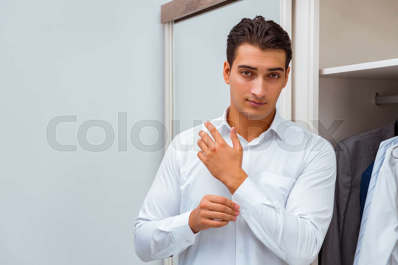 Businessman dressing up for work | Stock image | Colourbox