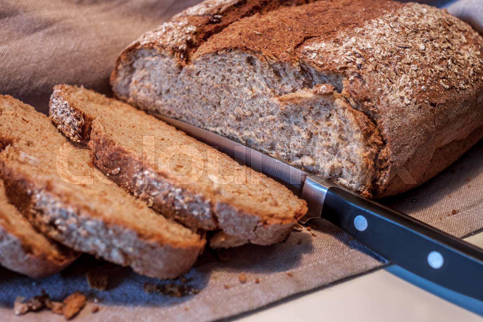 fresh bread cut by knife | Stock image | Colourbox