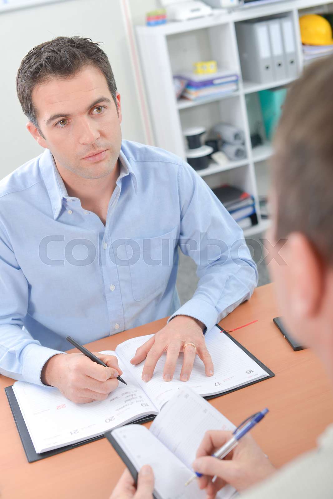 men setting an appointment | Stock image | Colourbox