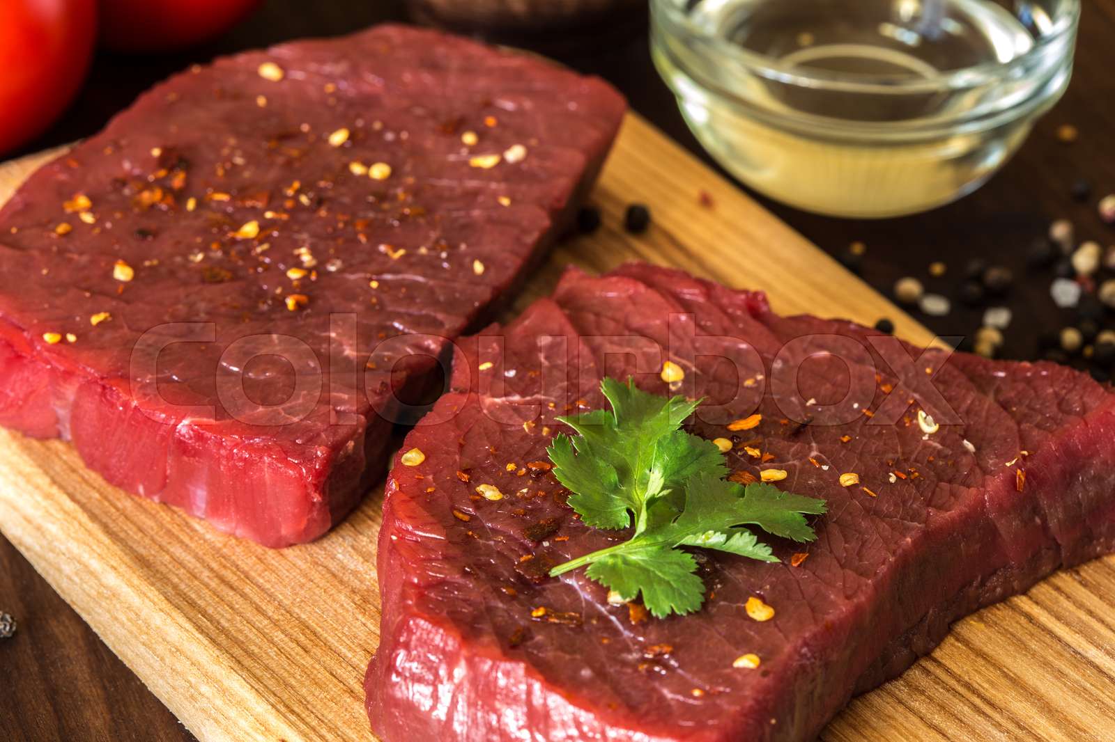 raw beef steak with ingredients for cooking | Stock image | Colourbox
