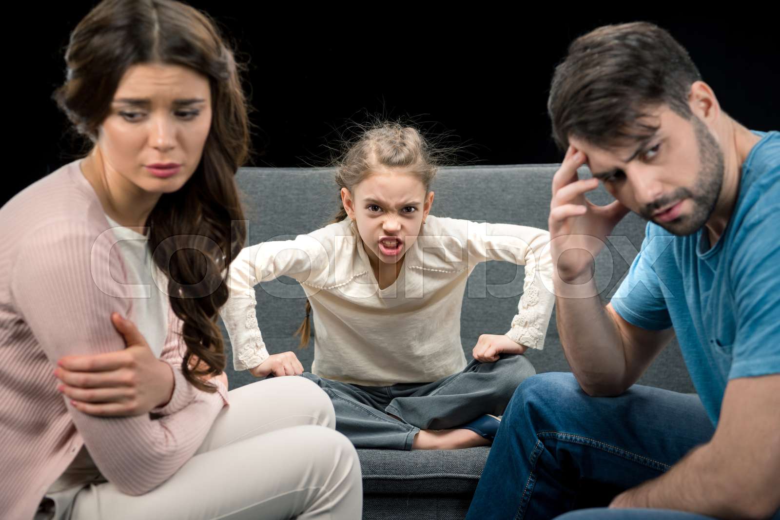 portrait of angry daughter and upset parents on black, family problems ...