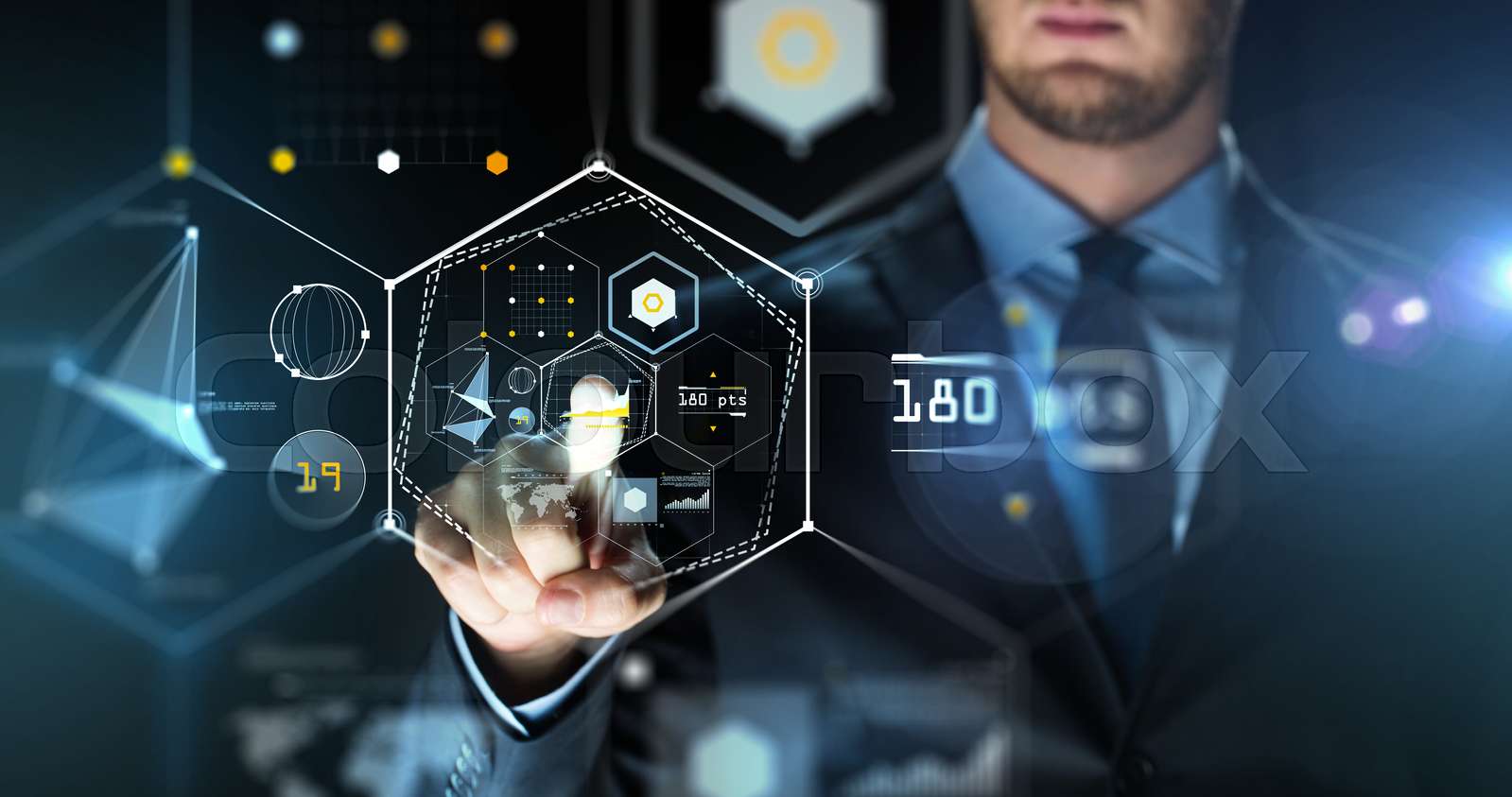 businessman touching virtual screen projection | Stock image | Colourbox