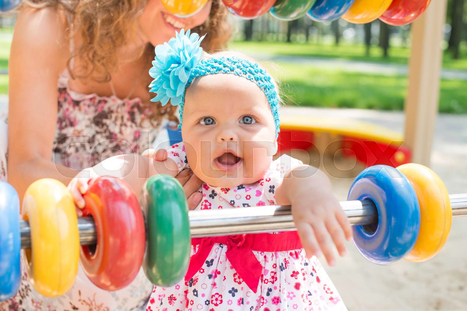 happy child girl riding train on funfair on summer vacation | Stock ...