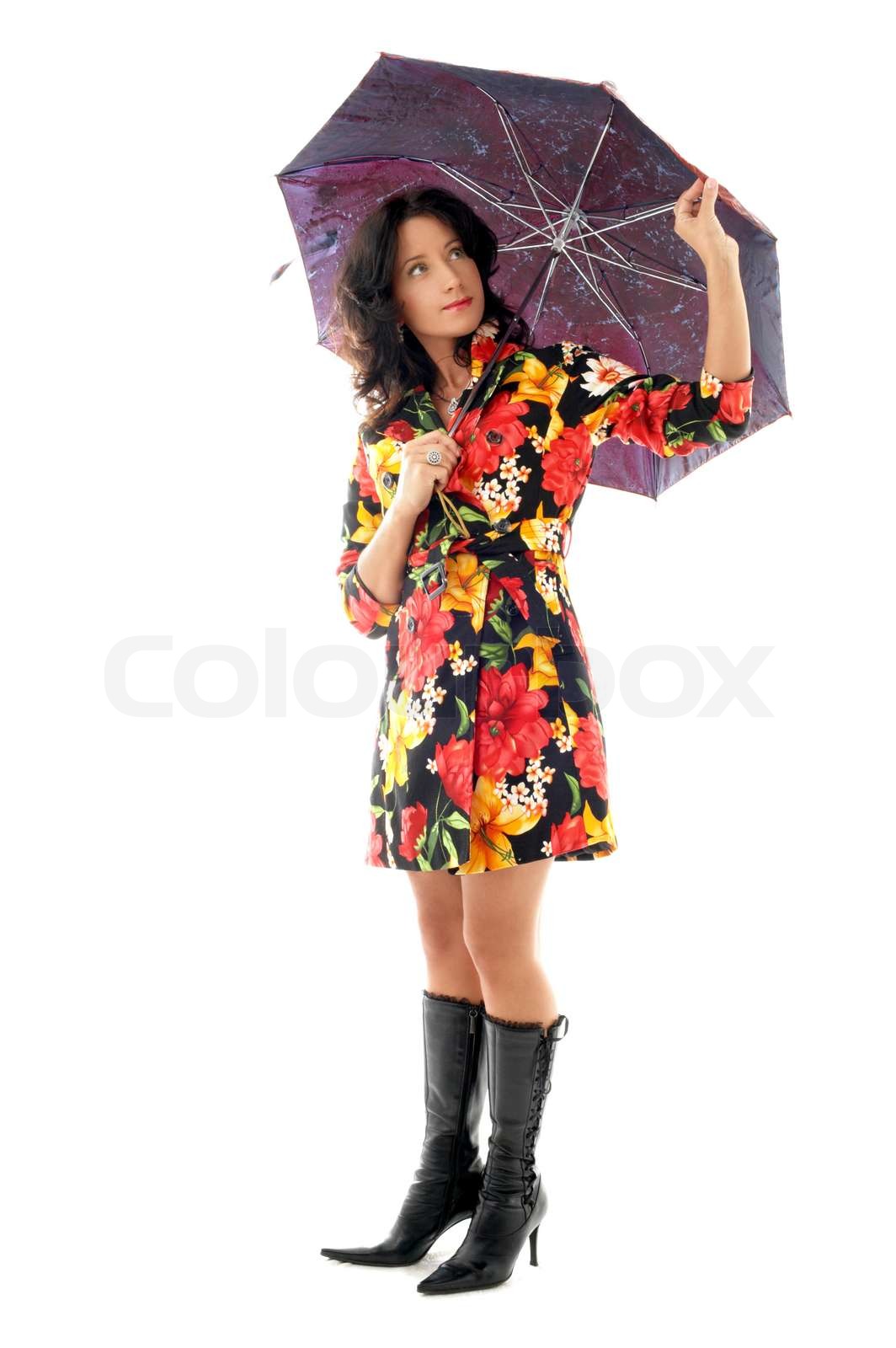 schöne Mädchen in bunten Mantel mit Regenschirm | Stock Bild | Colourbox