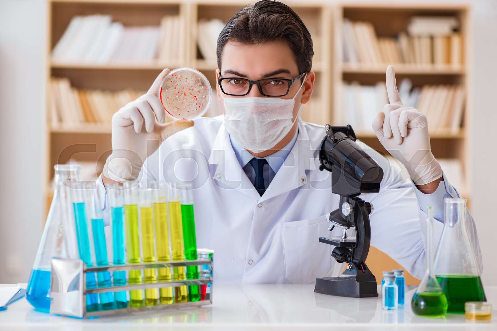 Doctor studying virus bacteria in the lab | Stock image | Colourbox