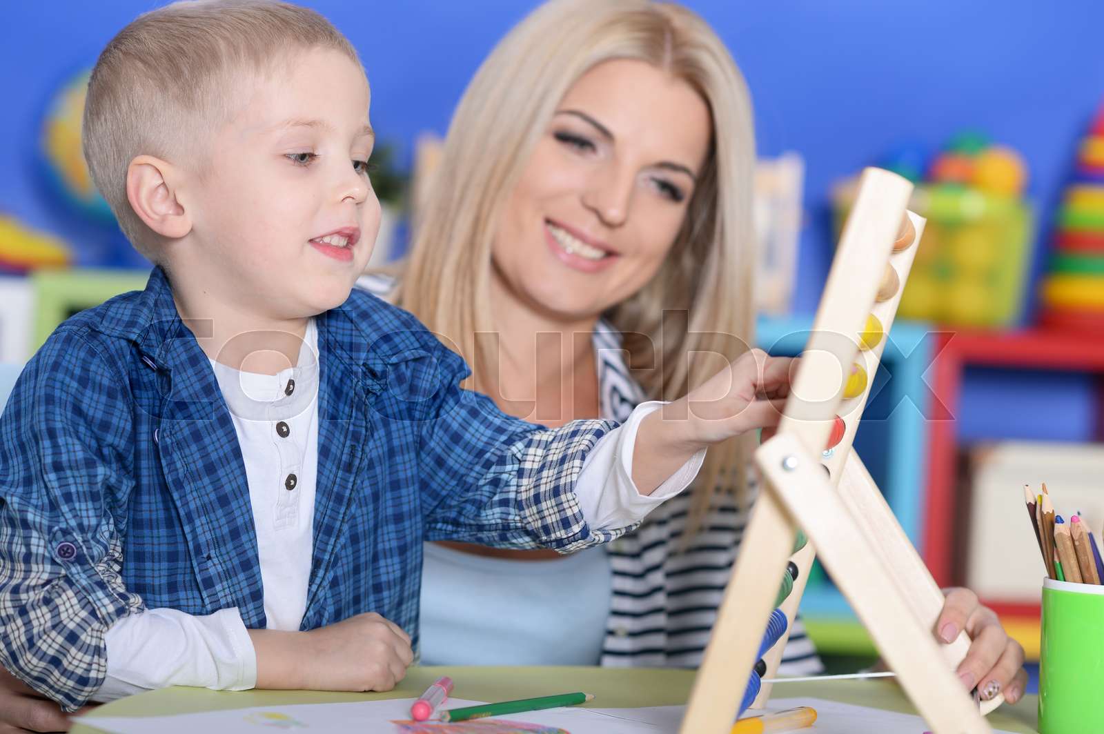 Mother teaches son to count | Stock image | Colourbox