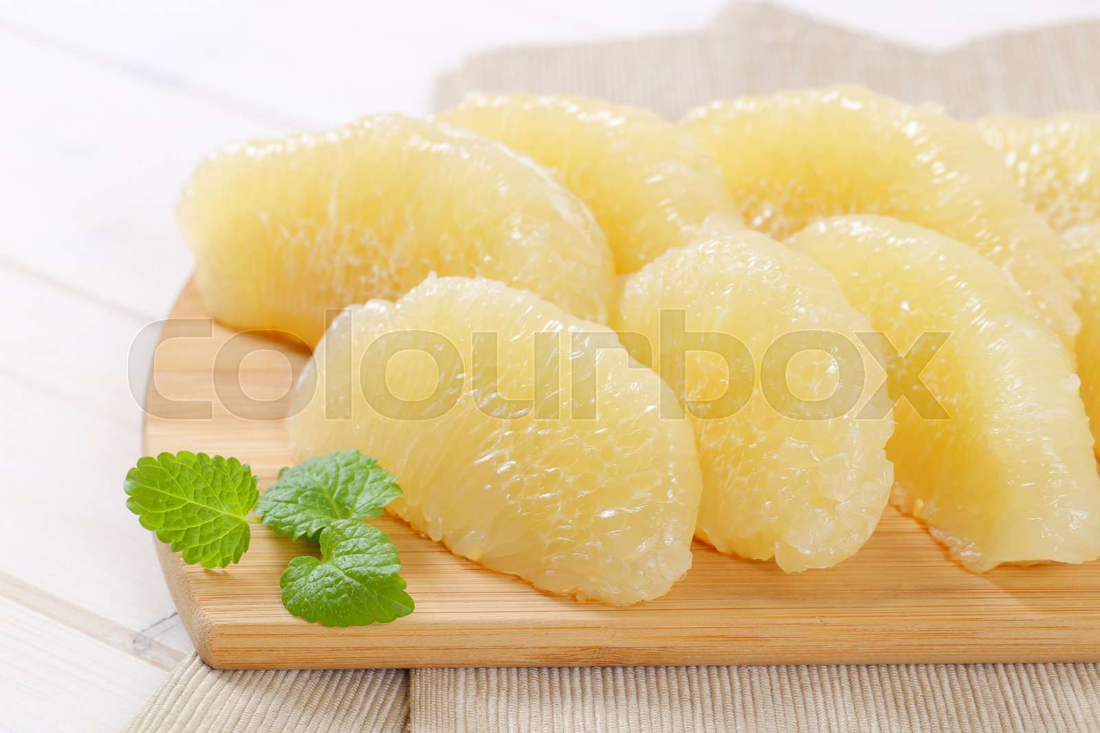 peeled pomelo segments | Stock image | Colourbox