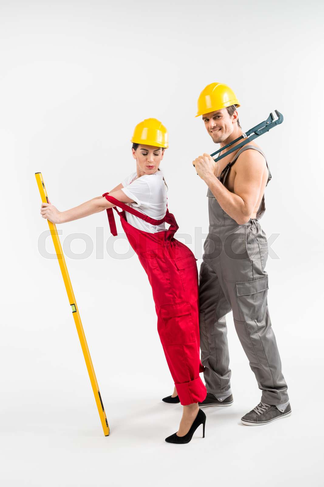 Male and female builders posing | Stock image | Colourbox