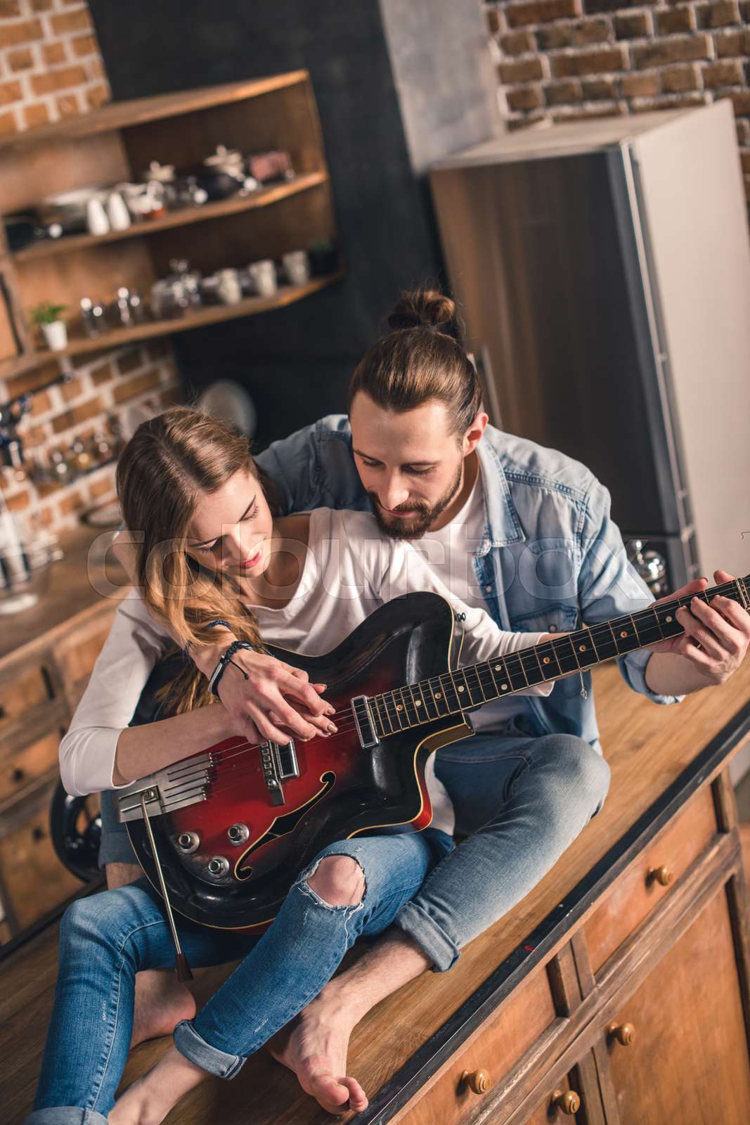 Young couple with guitar | Stock image | Colourbox