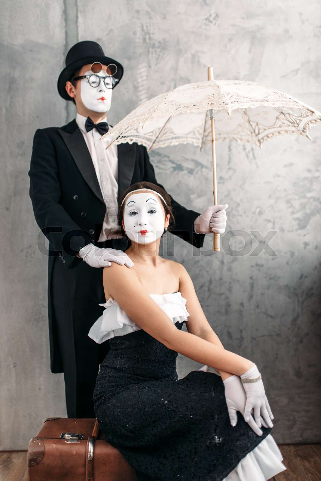 Pantomime theater performers posing with umbrella | Stock image | Colourbox