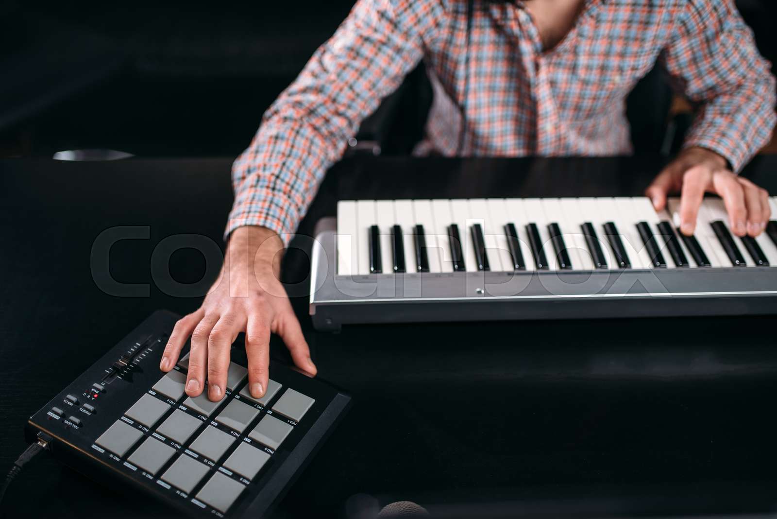Male sound producer hands on musical keyboard | Stock image | Colourbox