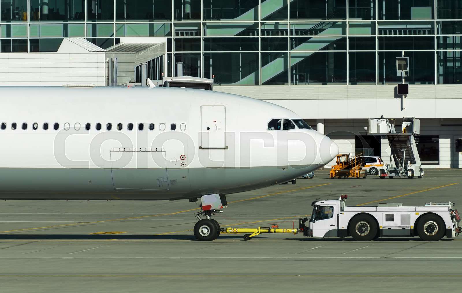 TUG Pushback tractor with Aircraft on the runway in airport. | Stock ...