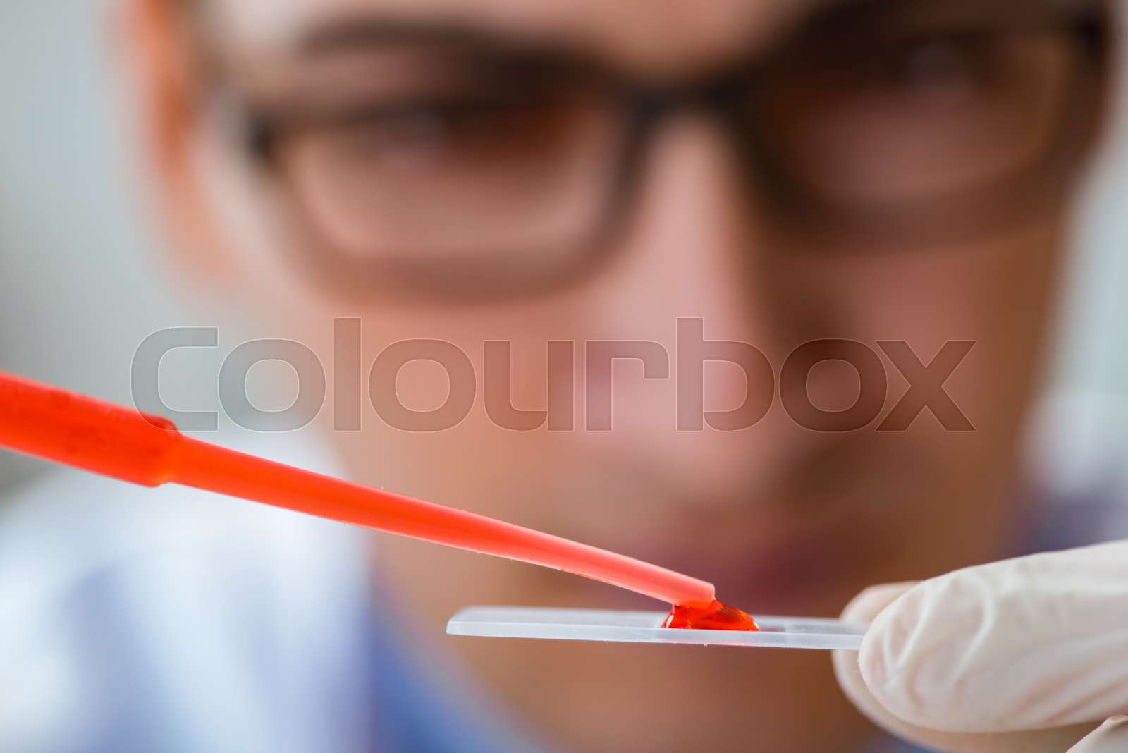 Doctor working with blood samples | Stock image | Colourbox
