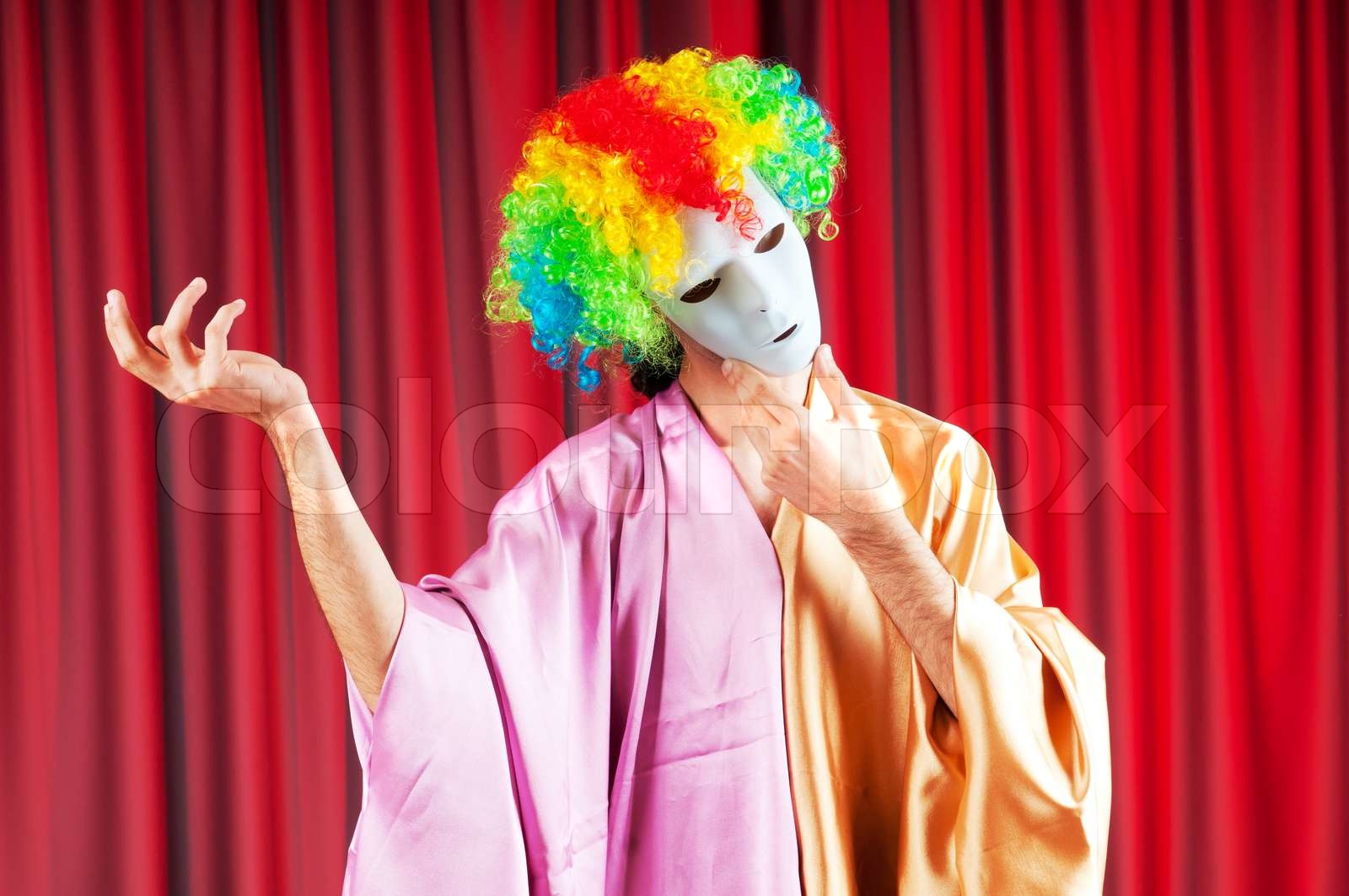 Theater concept with masked actor | Stock image | Colourbox