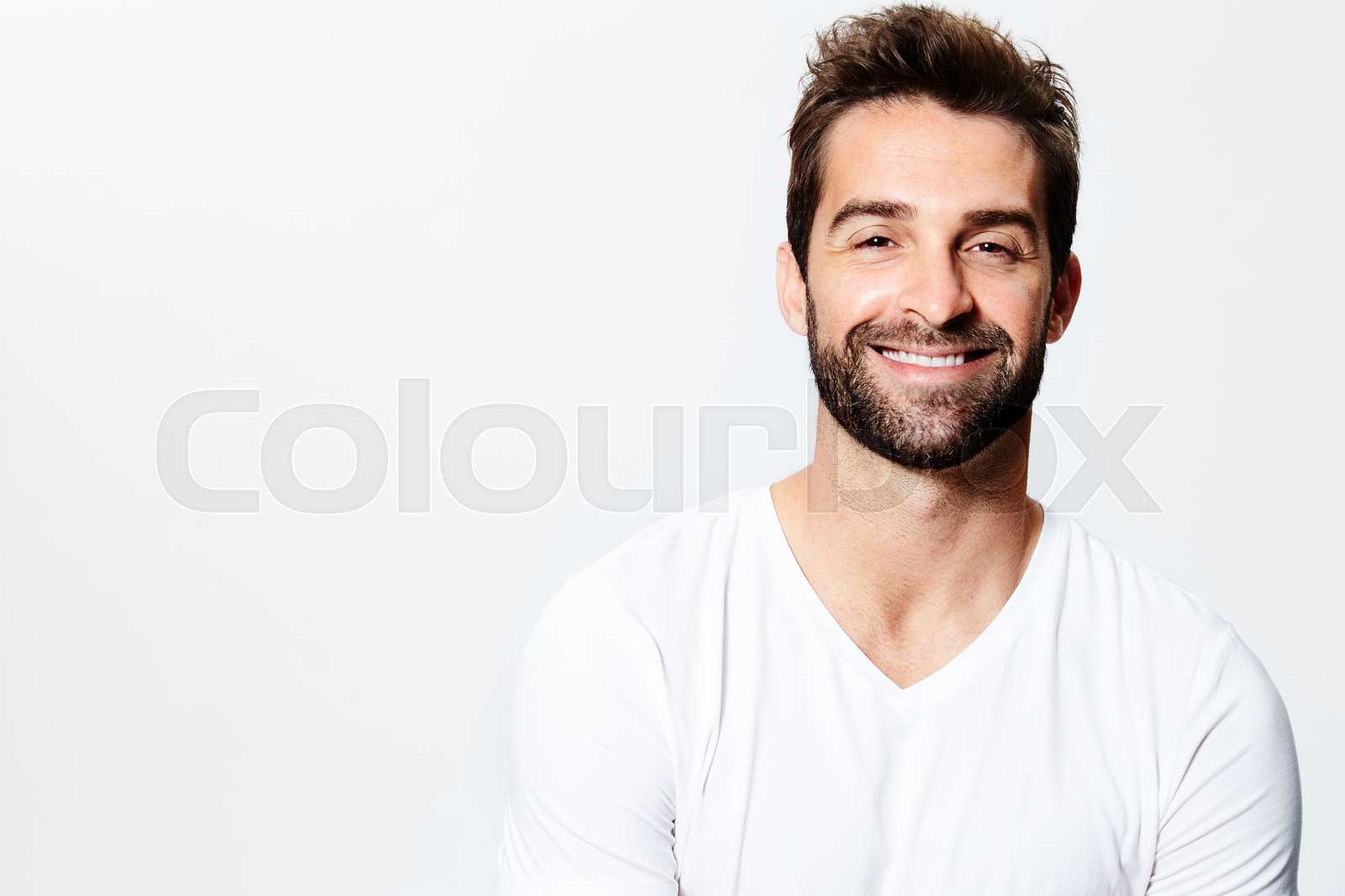 Smiling man in white | Stock image | Colourbox