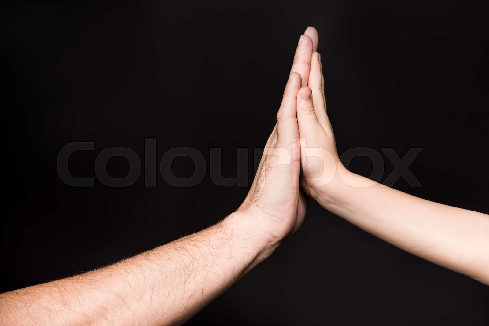 Father and child touching palms | Stock image | Colourbox
