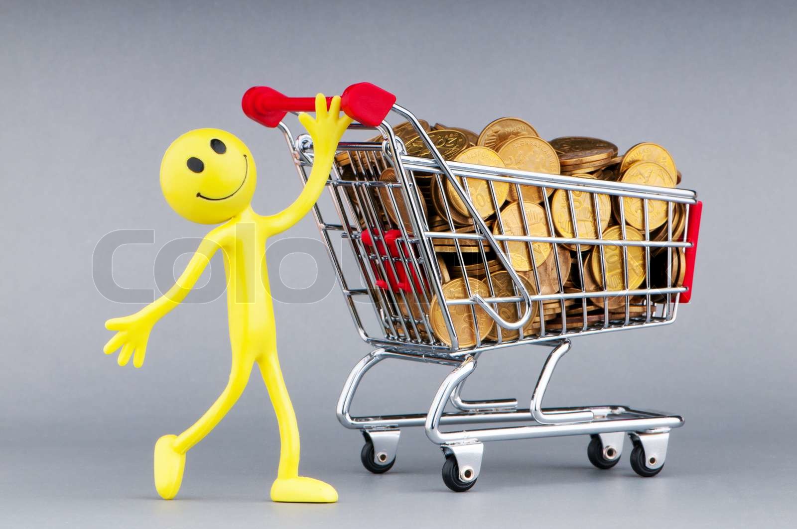 Smilies with shopping carts and coins | Stock image | Colourbox