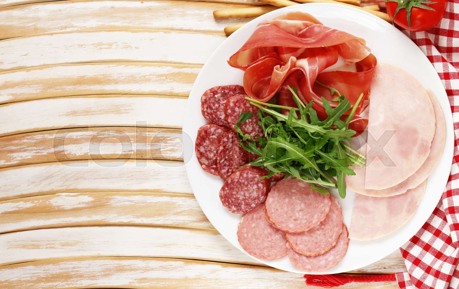 Assortment of meat delicacies (salami, parma, ham) | Stock image | Colourbox