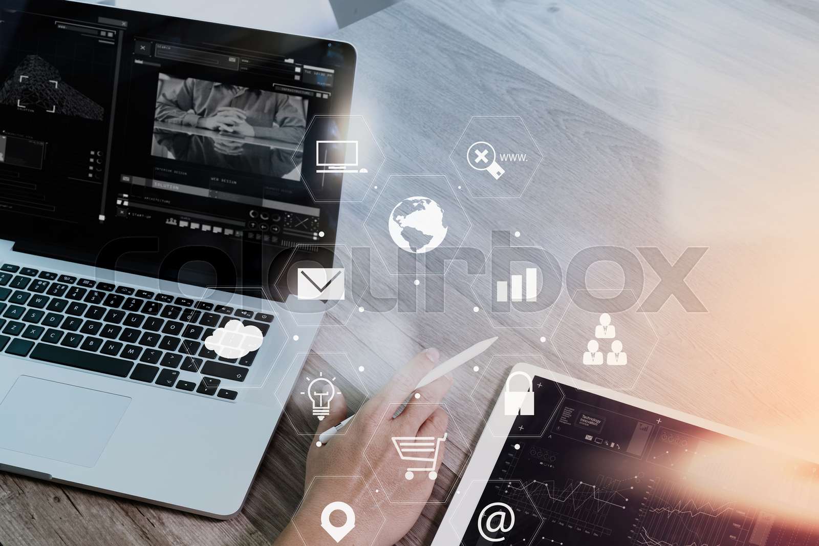 businessman working with smart phone and laptop computer on wooden desk ...