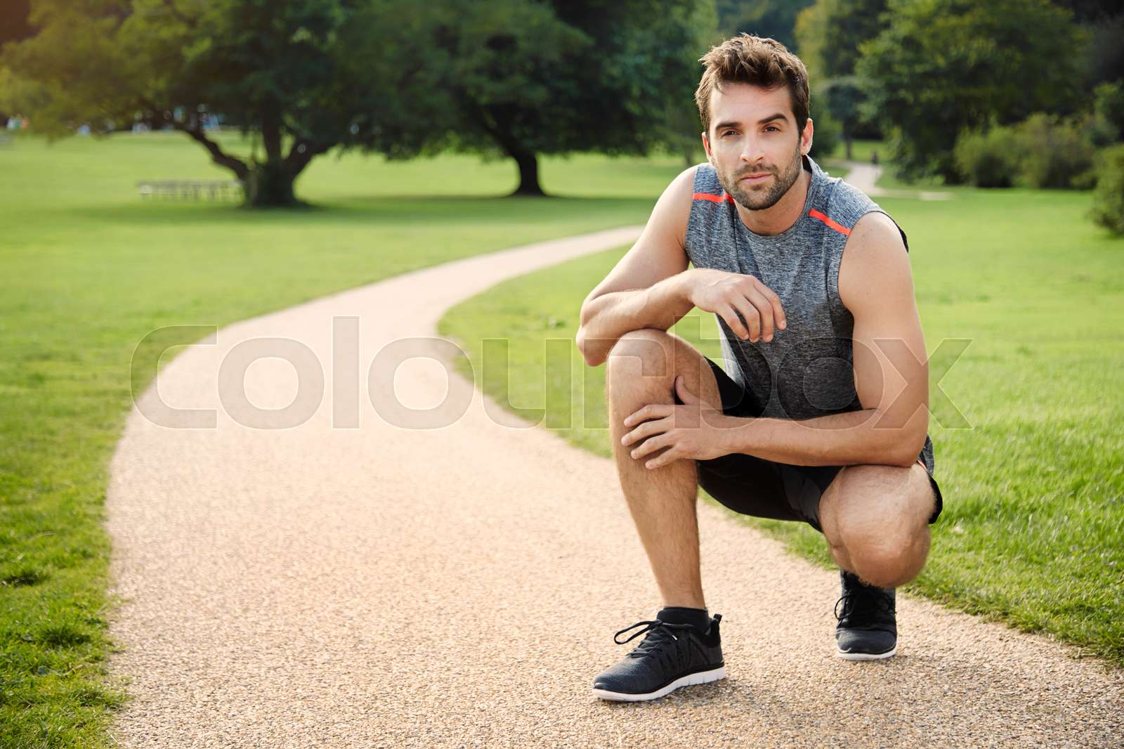 Athlete crouching | Stock image | Colourbox
