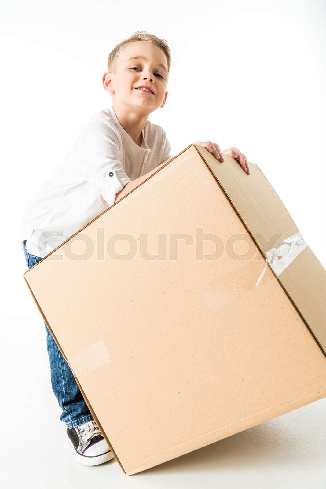 Boy with cardboard box | Stock image | Colourbox