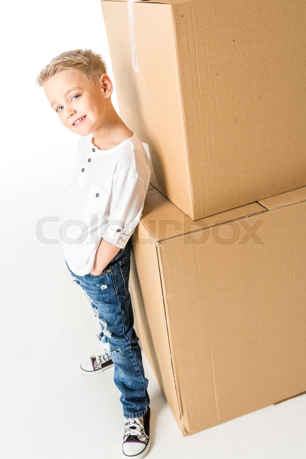 Boy with cardboard boxes | Stock image | Colourbox