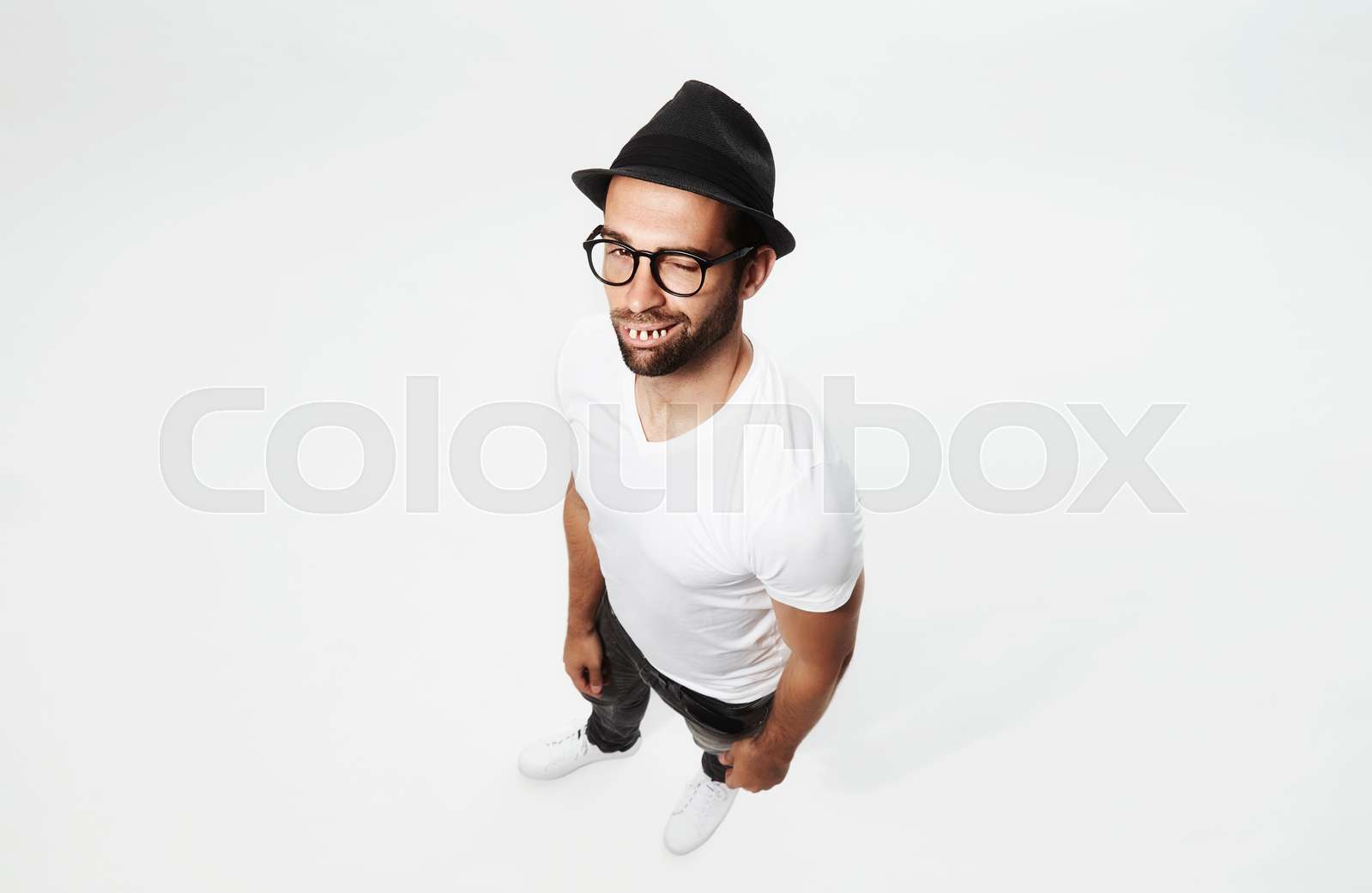Sleazy guy winking | Stock image | Colourbox