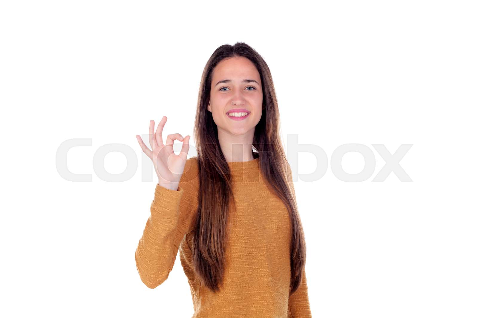 Beautiful young girl showing ok sign | Stock image | Colourbox