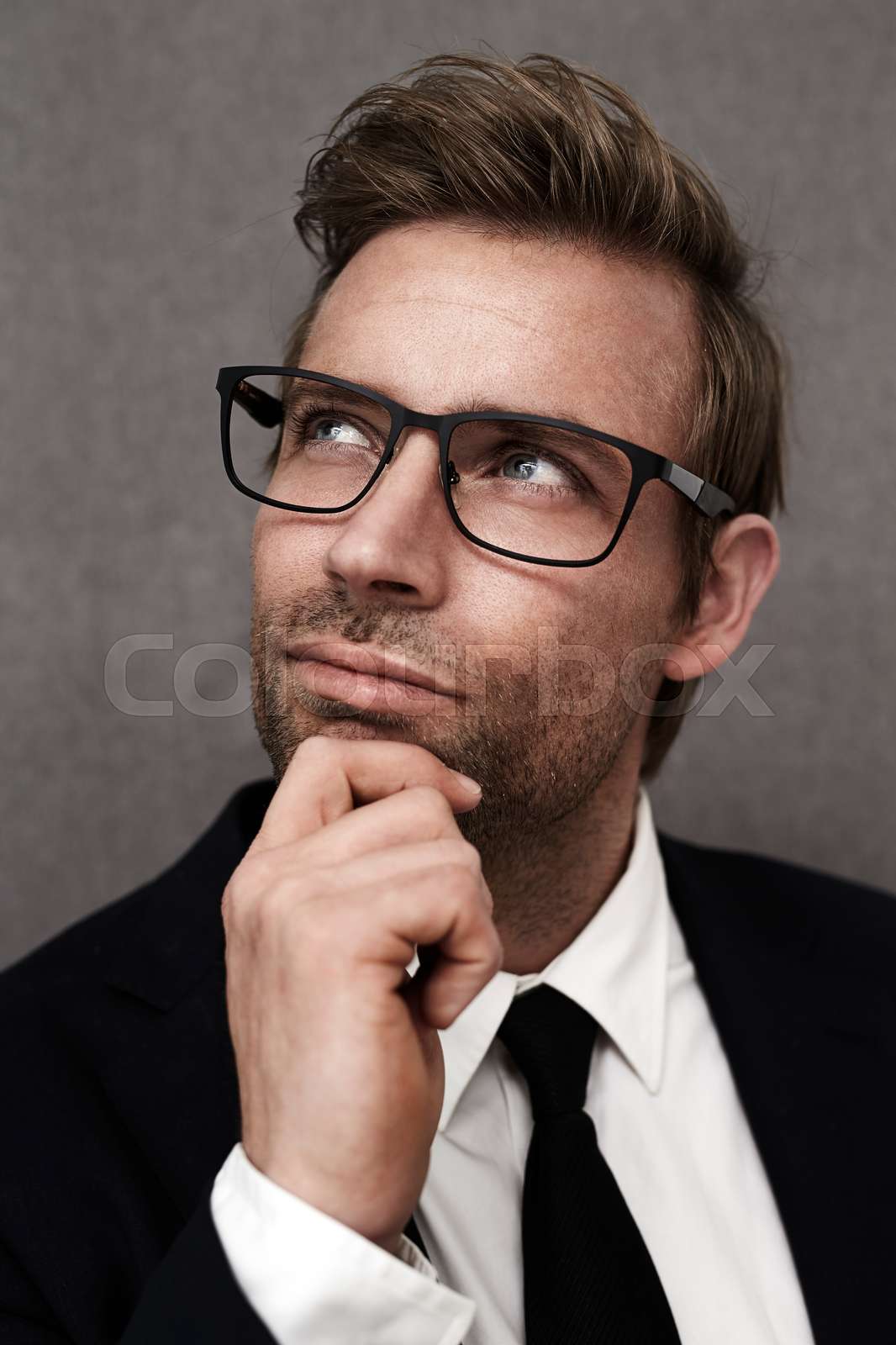 Thoughtful smart guy | Stock image | Colourbox