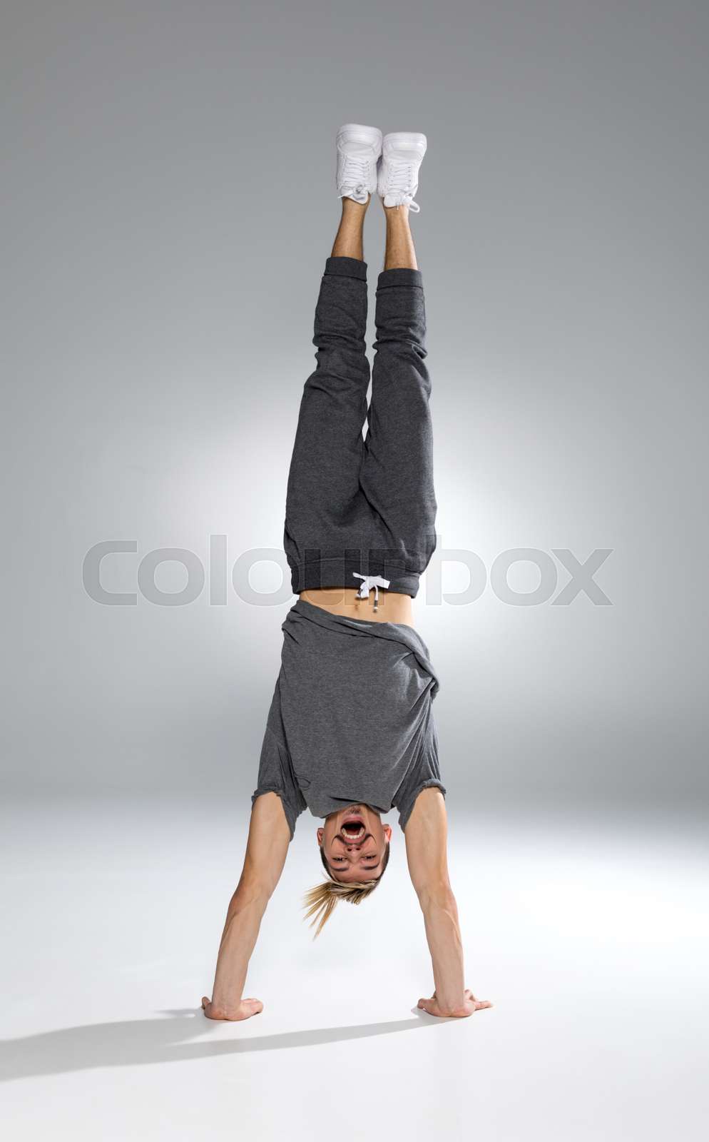 Man performing handstand | Stock image | Colourbox
