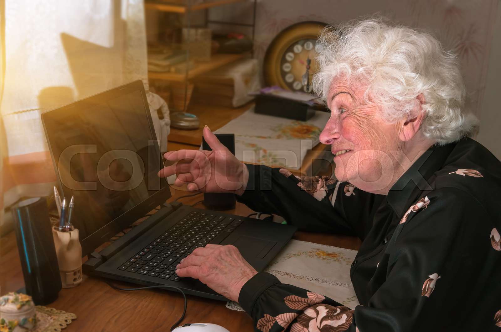 Grandmother learns to work at home on the computer | Stock image ...