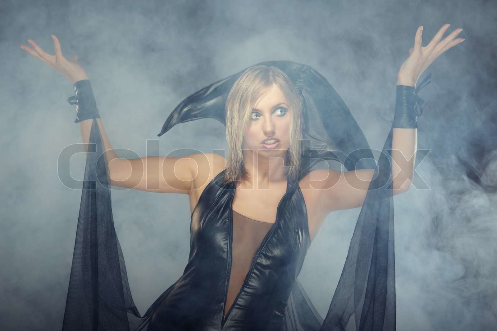Indoors photo of the female witch in the heavy smoke | Stock image ...