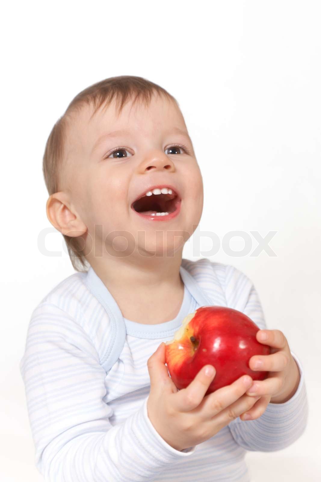 Baby mit roten Apfel | Stock Bild | Colourbox