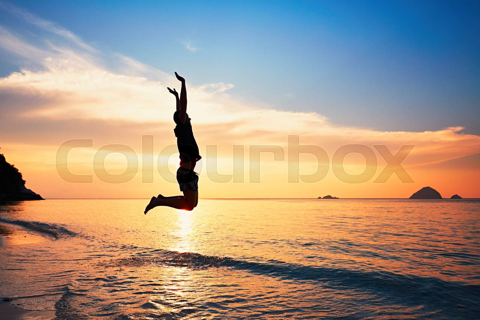 Man jumping into the sea | Stock image | Colourbox