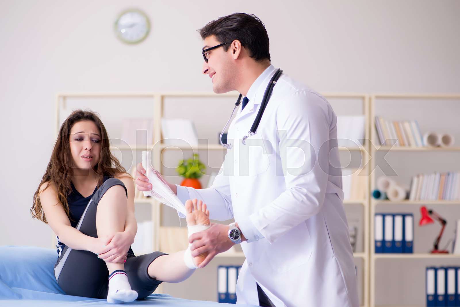 Traumatologist is taking care of the patient | Stock image | Colourbox