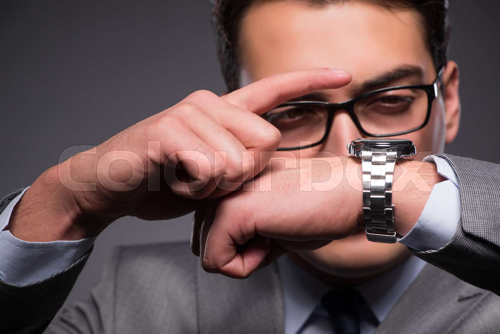 Businessman in time management concept | Stock image | Colourbox