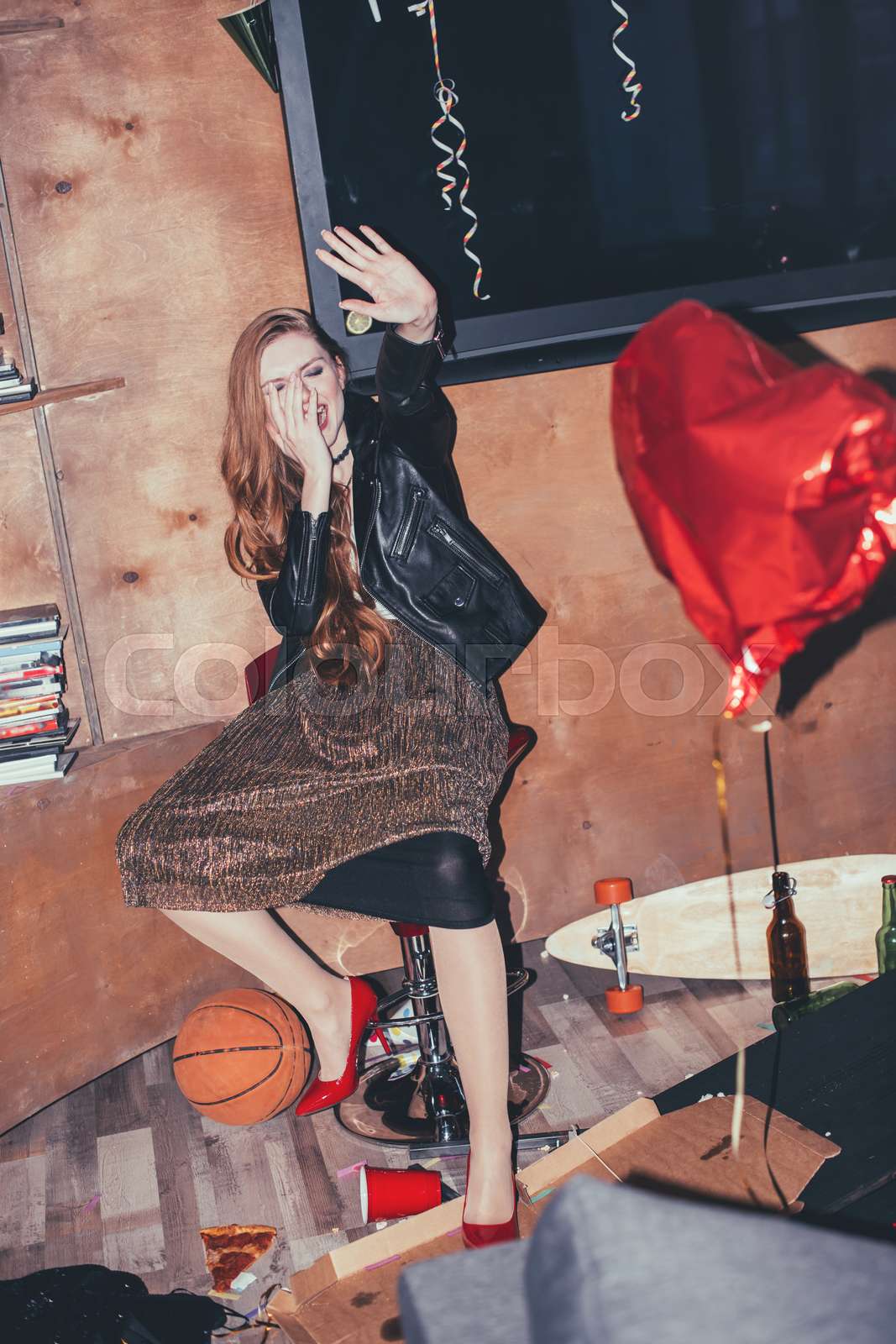 young drunk woman in messy room after party | Stock image | Colourbox