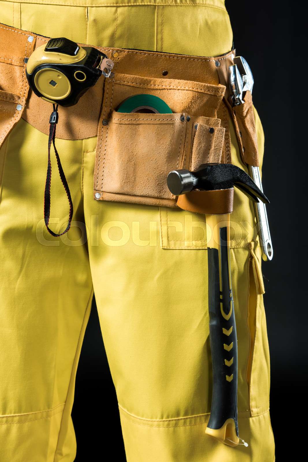 Workman in tool belt | Stock image | Colourbox