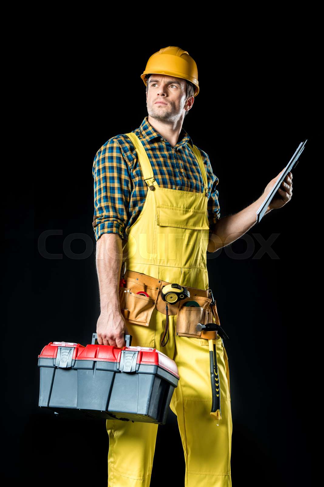Workman holding tool kit | Stock image | Colourbox