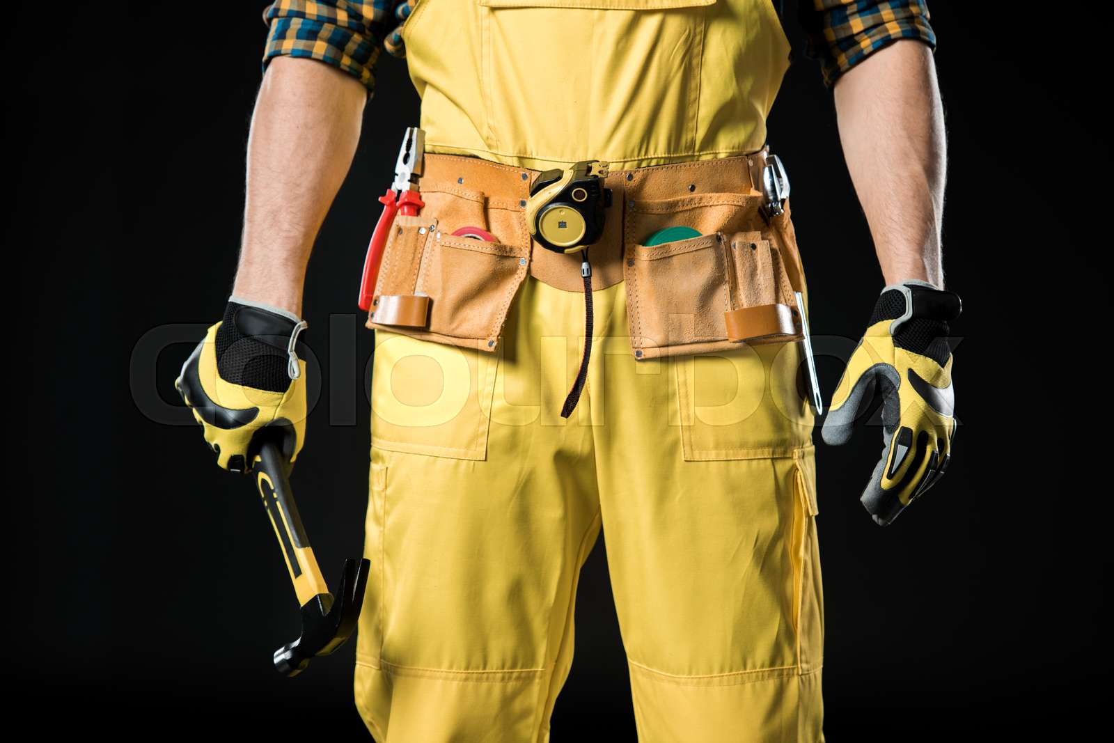 Workman in tool belt | Stock image | Colourbox