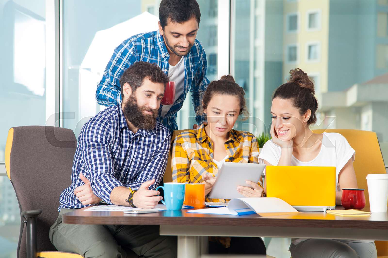 Young proffessional team working together in the office | Stock image ...