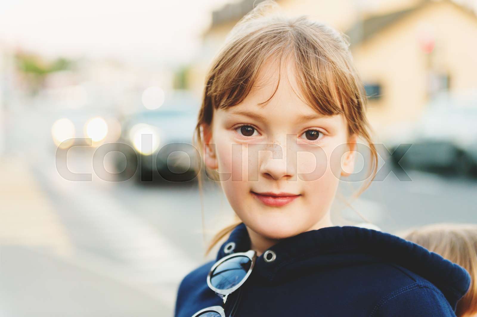 Candid Close Up Portrait Of Young 9 Year Old Girl Walking Next To Road