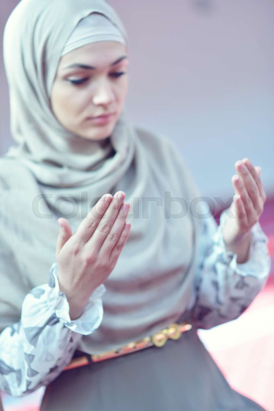 muslim woman praying in mosque | Stock image | Colourbox