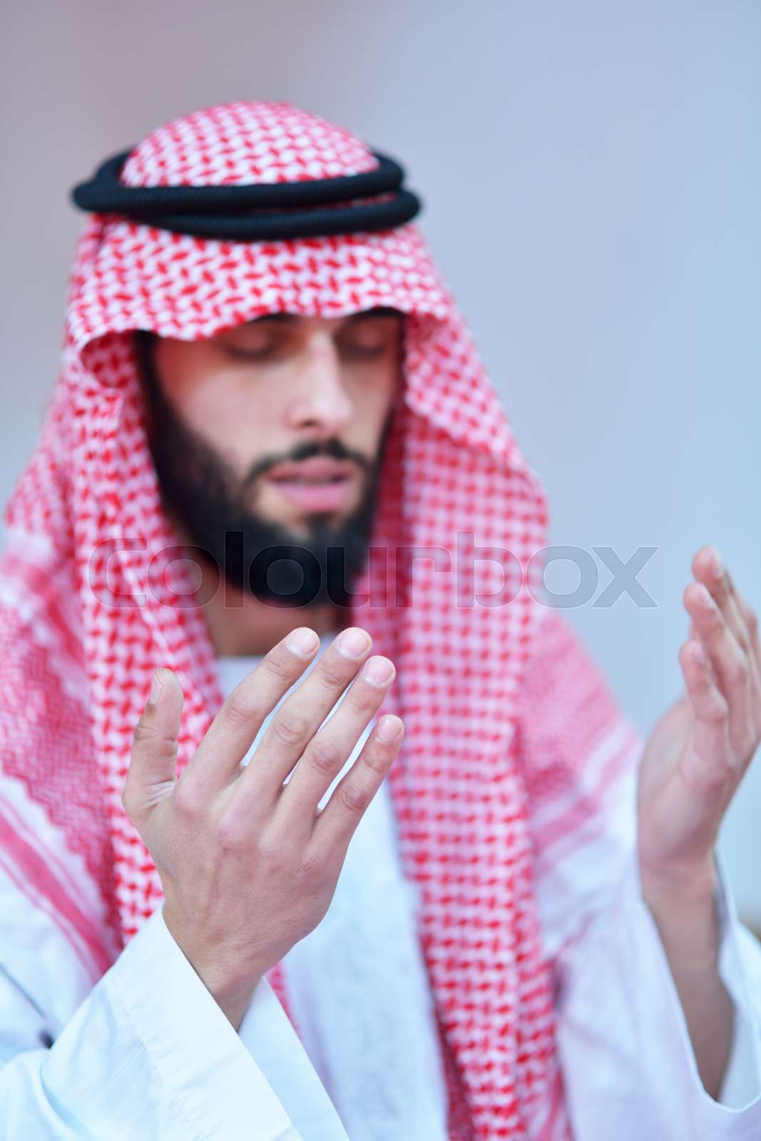Muslim Arabic man praying | Stock image | Colourbox