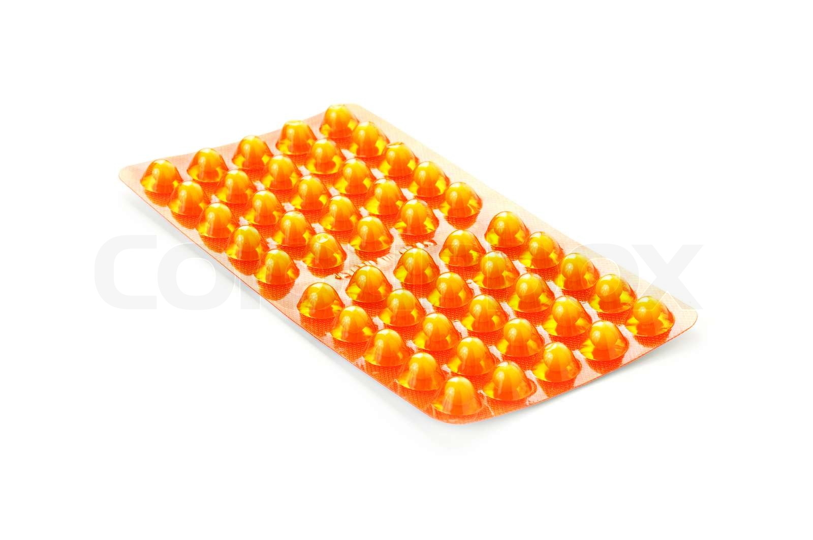 Package with yellow vitamin tablets on the white | Stock image | Colourbox